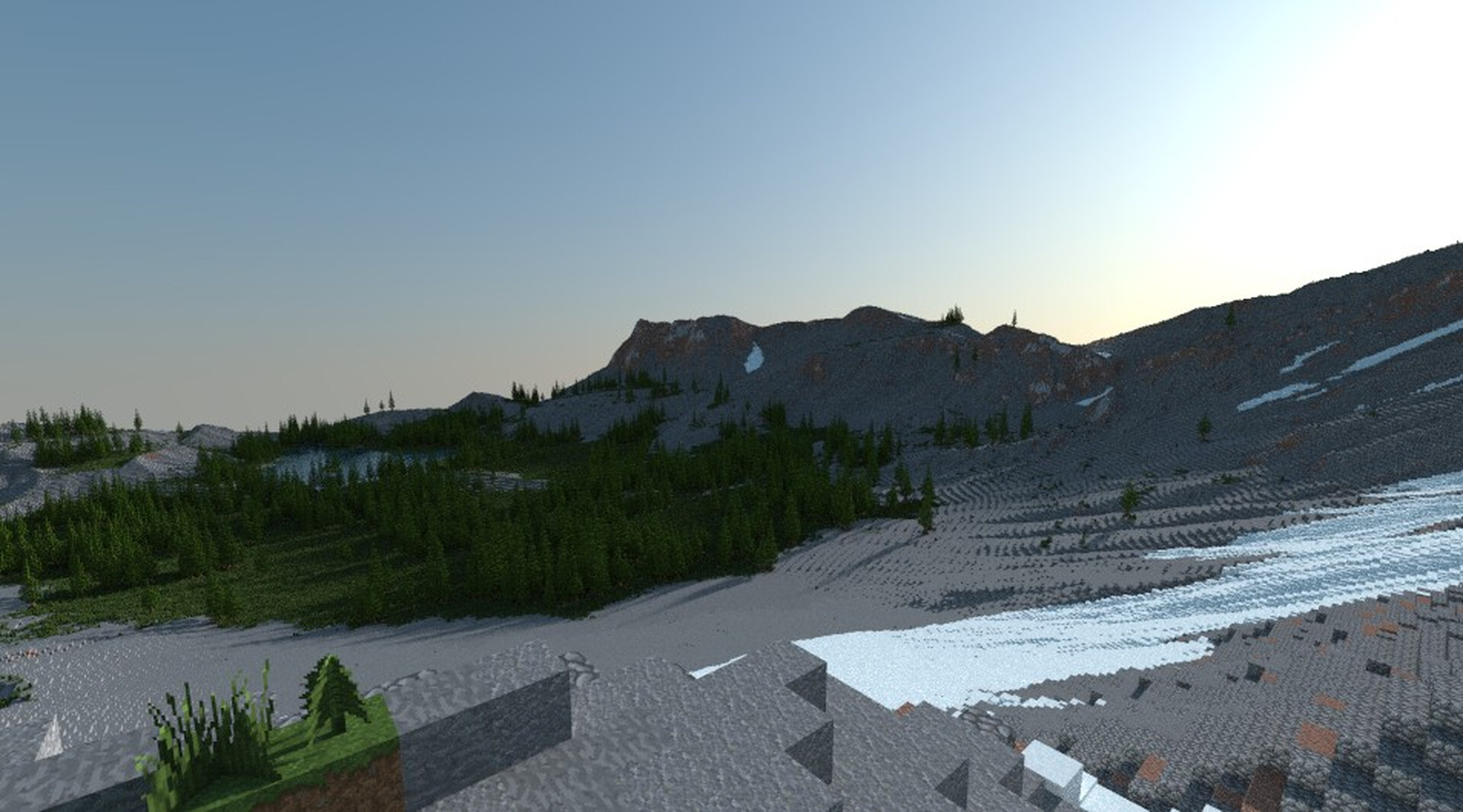 A lake in the mountains in the middle of a small field Minecraft Map