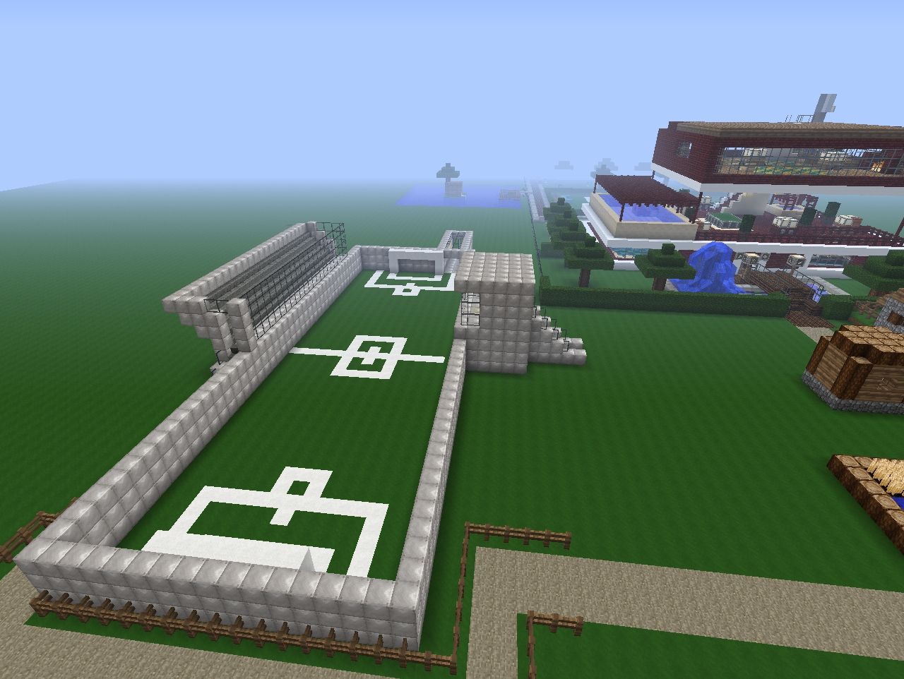 Modern netherack mansion+football stadium+ice skating rink Minecraft Map